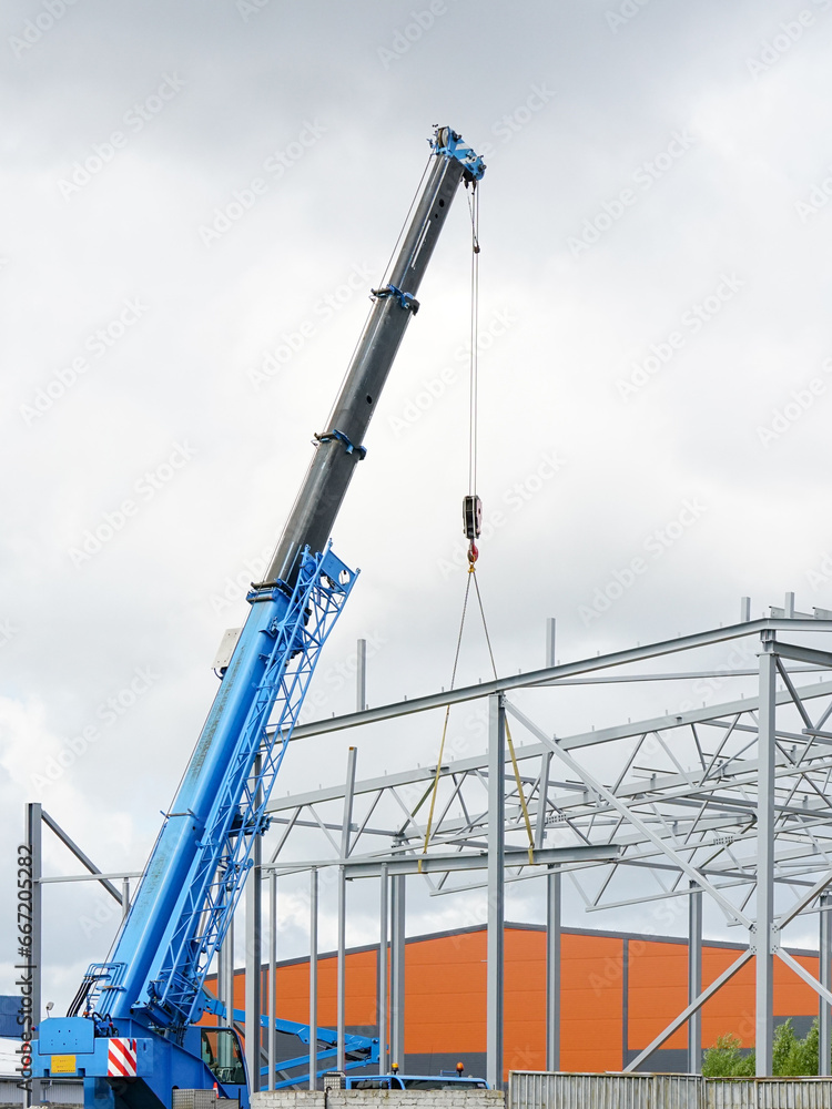 Steel frame structure assembly using telescopic boom crane and self ...