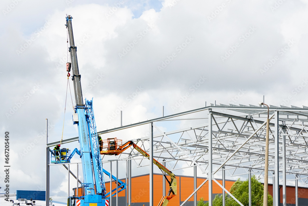 Steel frame structure assembly using telescopic boom crane and self ...