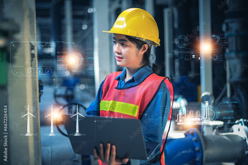 Asian Women Engineer checking facility system in factory and using ...