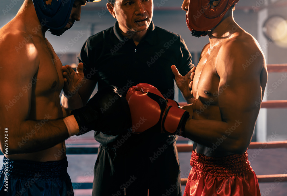 Boxer fighter with safety helmet or head guard face off with each other ...
