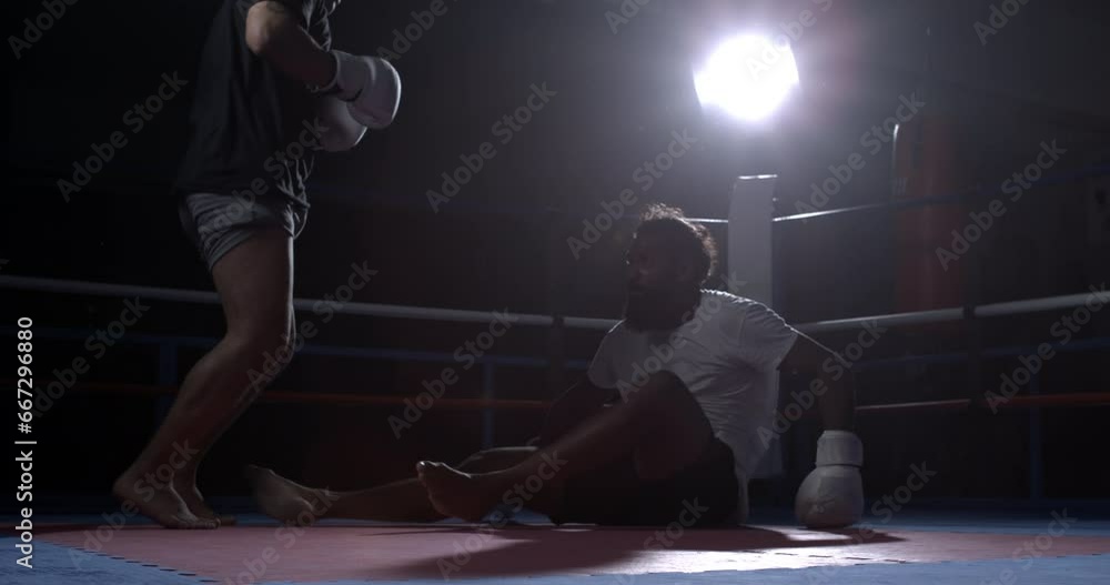 Fighter raising himself from floor after defeat. Warrior resilience ...