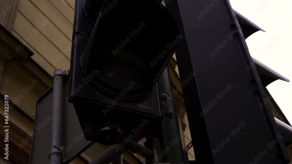 Close-up of traffic light at intersection of large city,regulating ...