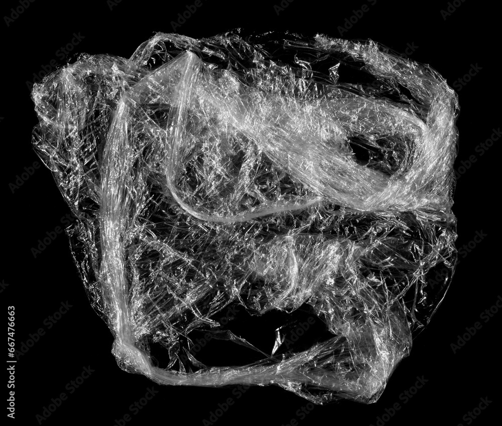 Wrinkled plastic wrap texture on a black background wallpaper. Royalty ...