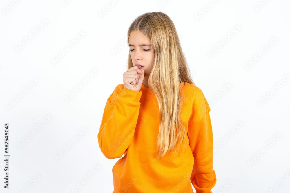 Beautiful teen girl feeling unwell and coughing as symptom for cold or ...
