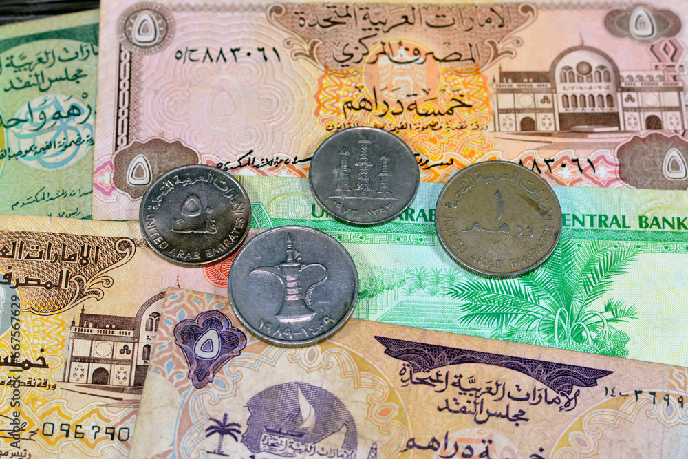 United Arab of Emirates money background of old coins and banknotes of ...
