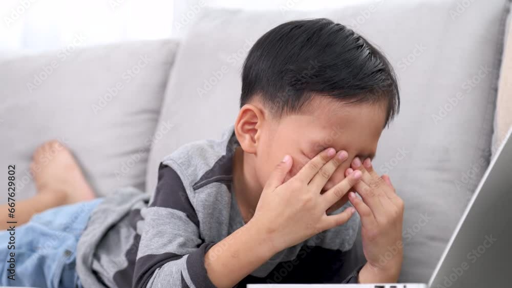 Asian little boy addicted to modern technology laptop connected to ...