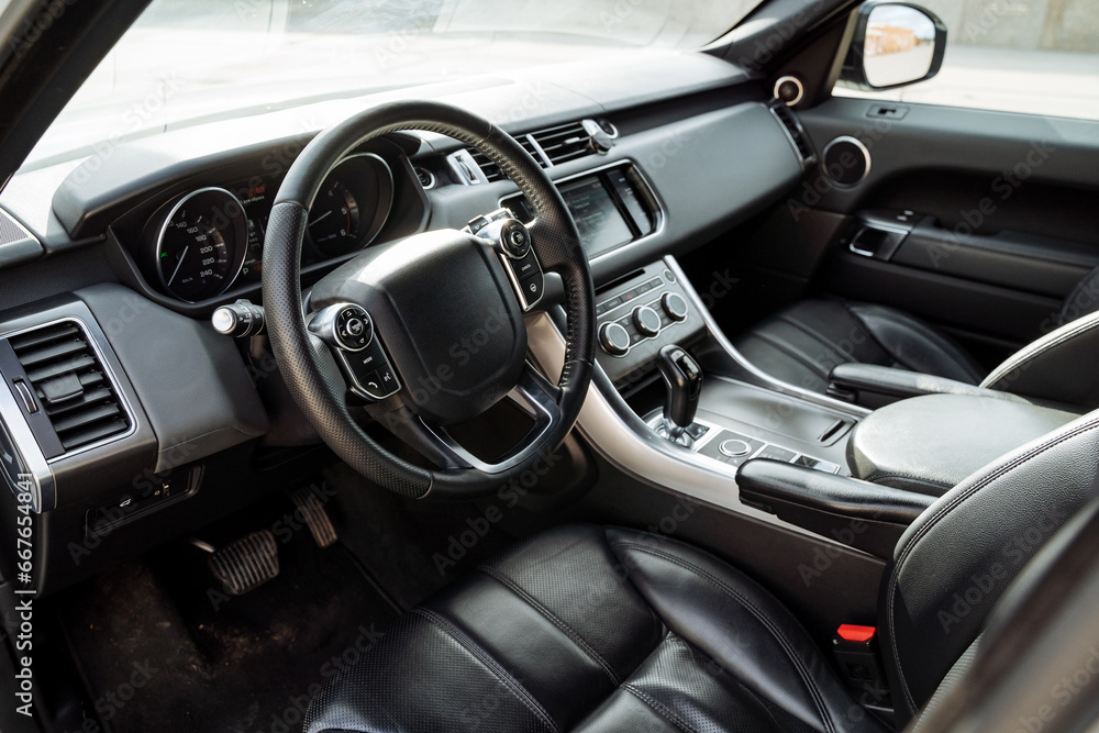 The steering wheel in the car is on the left side, the instrument ...