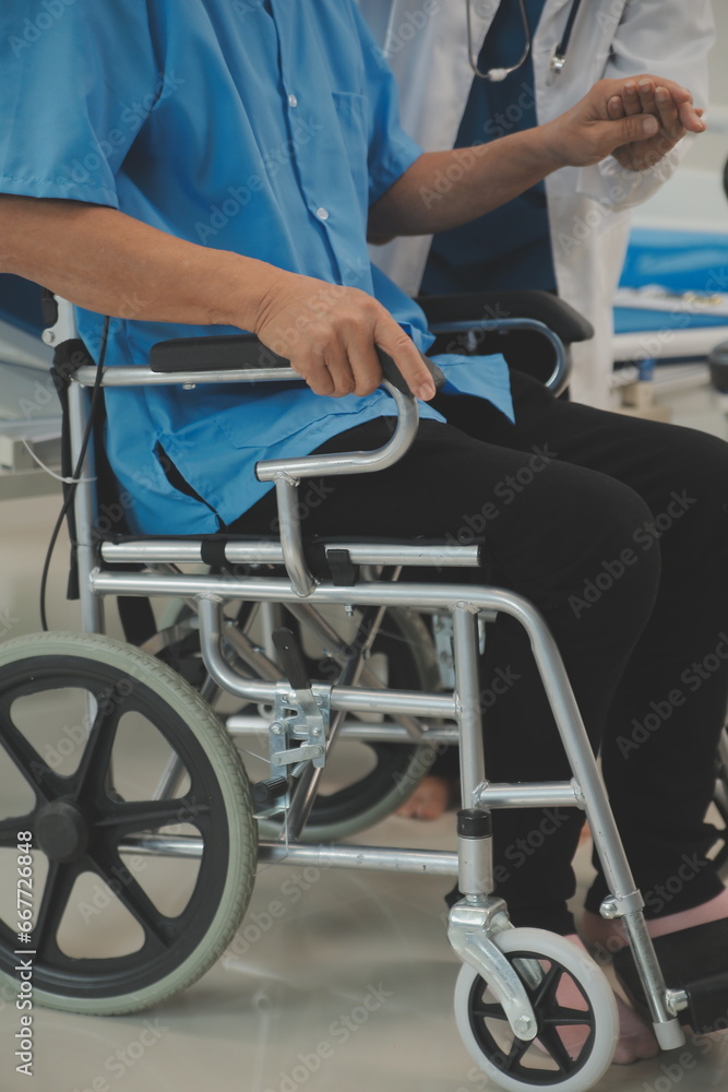 Asian older aged man doing physiotherapist with support from nurse ...