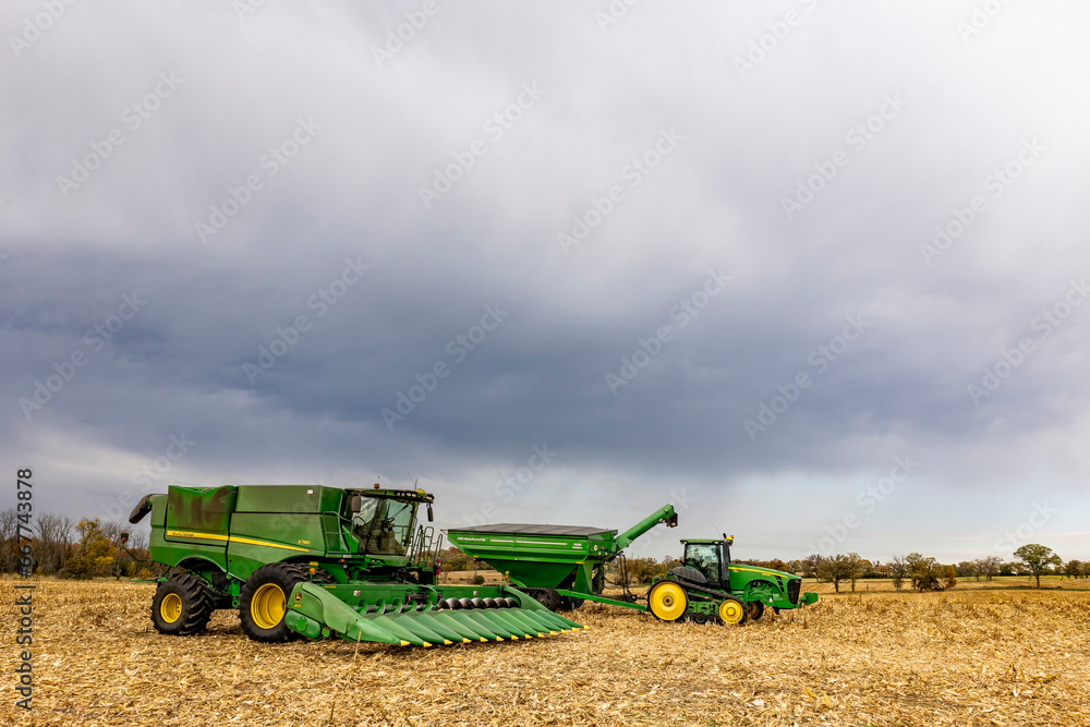 John Deere S780 Combine with a 612 C corn head and a John Deere 8295 RT ...