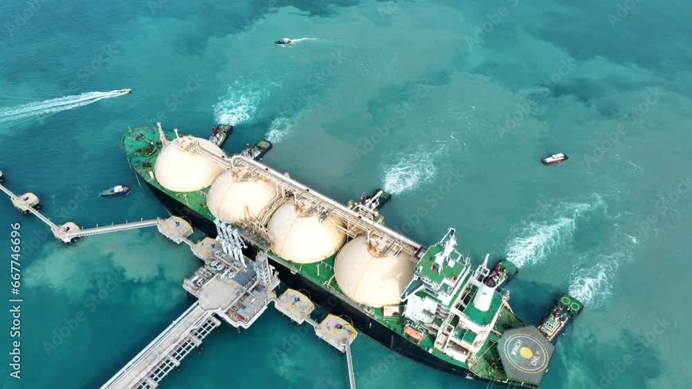 LNG (Liquefied natural gas) tanker anchored in Gas terminal gas tanks for storage. Oil Crude Gas ...