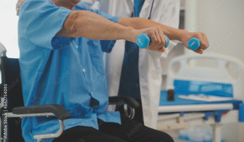 Asian older aged man doing physiotherapist with support from nurse ...