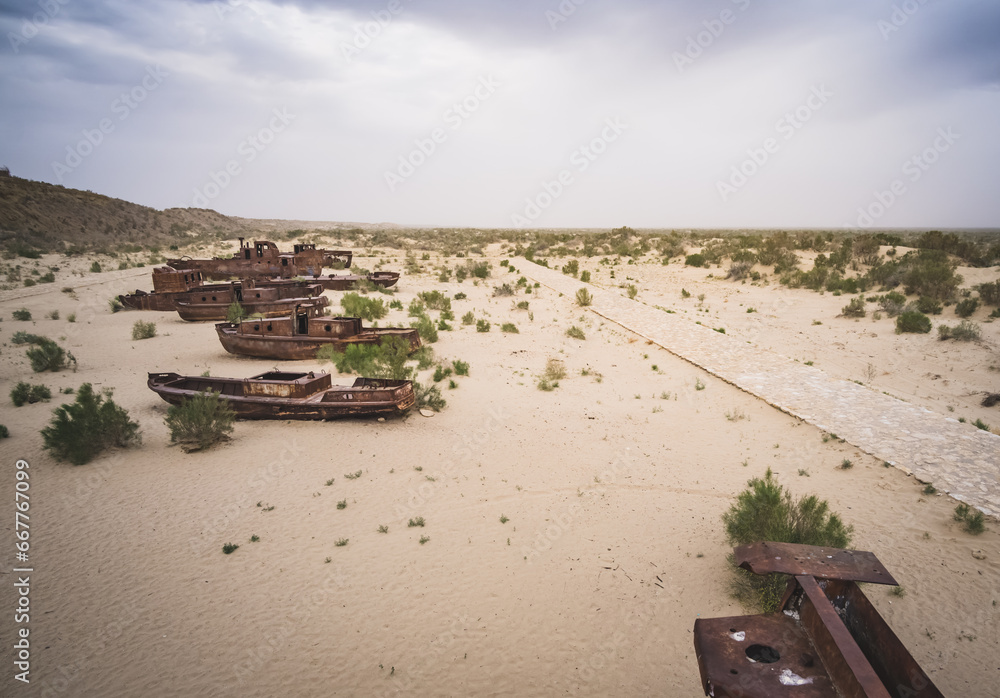 Rusty ships and boats in the desert at the bottom of the dried up Aral ...