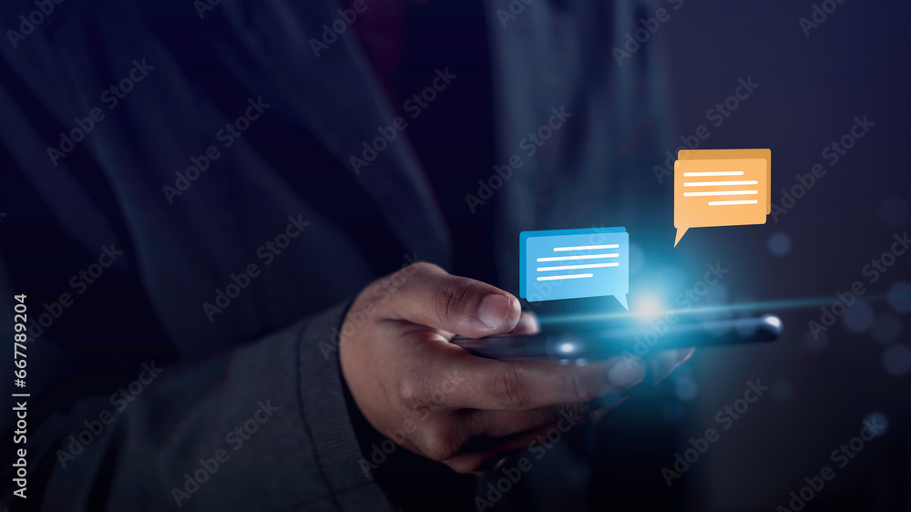 Hand using smartphone online typing chat with friend or service help ...