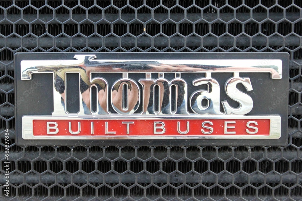 the emblem for thomass built buses on the grille of a pickup truck ...