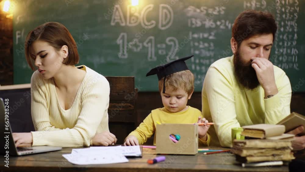 Vidéo Stock Kids learn and study in home school. Family playing at home ...