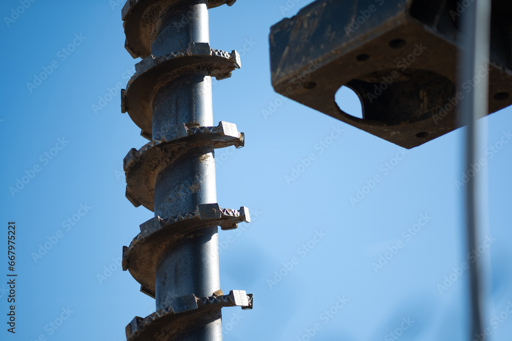 Details of a massive drill used to dig the foundation pilings for a ...