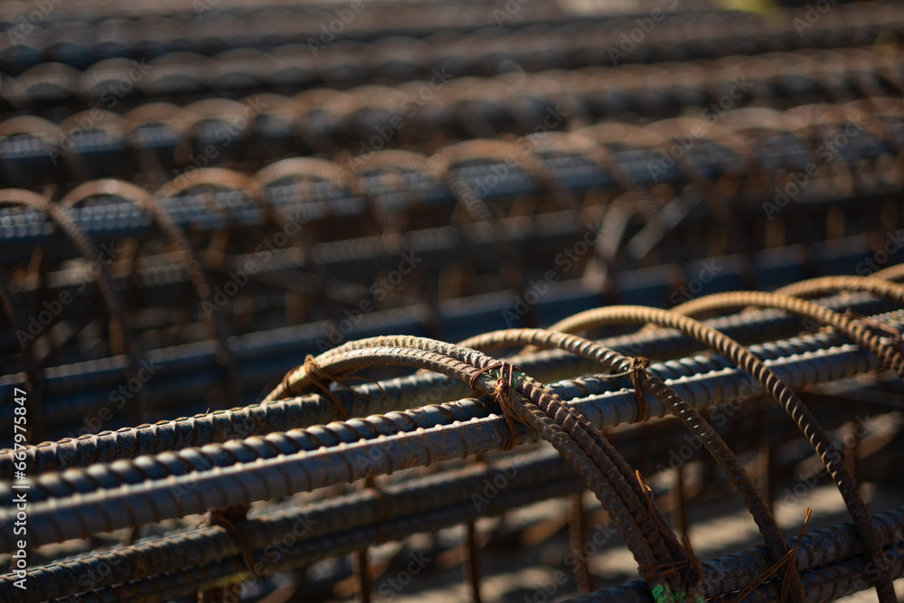 At a construction site, there is an array of round mesh reinforcements ...