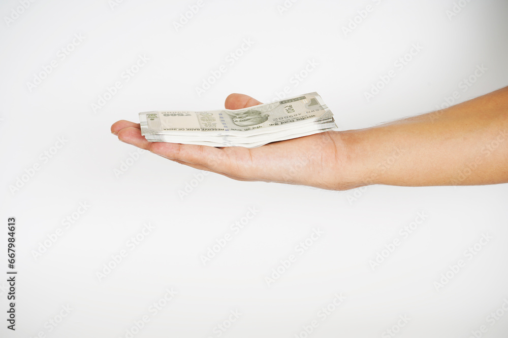 Bundle of indian currency note in hand on white background, money ...