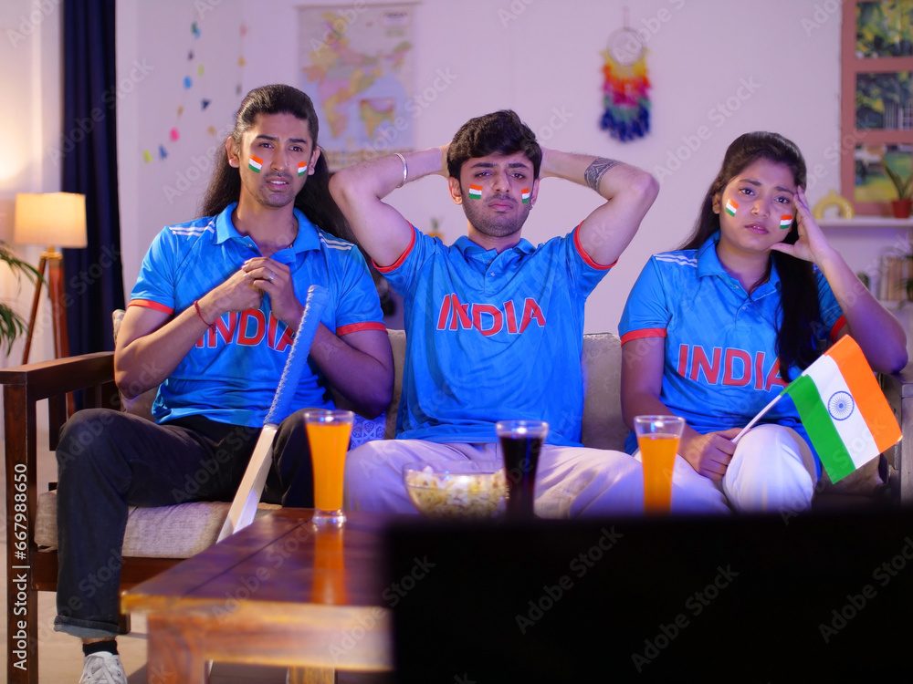 Indian friends wearing Indian cricket jerseys watching a cricket match ...