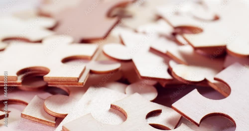 Closeup of Jigsaw Puzzle pieces placed on a turning table revealing ...