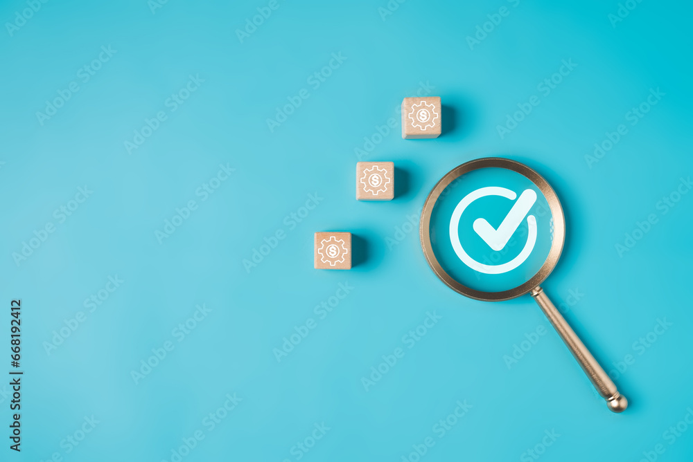 Foto de Magnifying glass with check mark icon and gear wheel setting ...