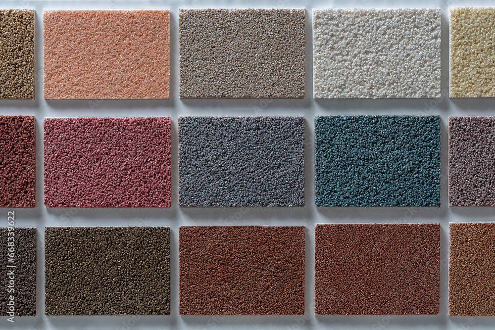 Samples of multi colored plaster for the decoration of the facade and ...
