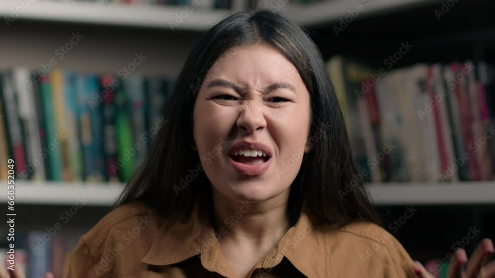 Angry furious stressed asian woman shouting irritated emotion in ...
