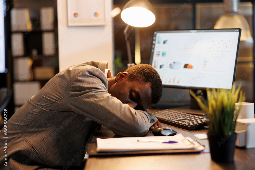 Workaholic manager sleeping on desk in startup office after working ...