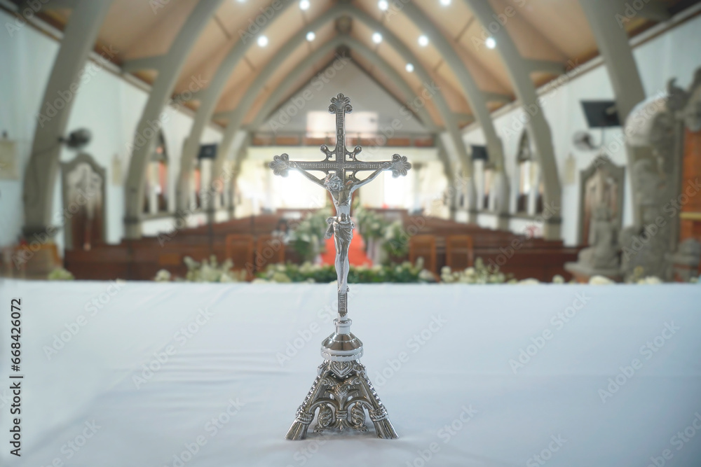 Jesus Christ on cross. Holy cross crucifix stand on the altar with ...