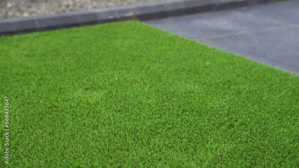 Vidéo Stock Close up shot of fake astro turf grass which is perfectly ...
