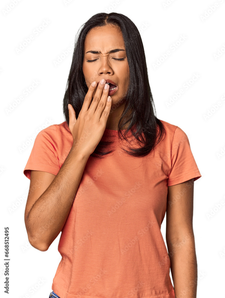 Young Filipina with long black hair in studio yawning showing a tired ...