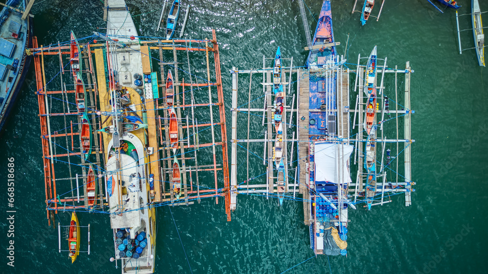Filipino long-range fishing boats known as mother ships moored at the ...