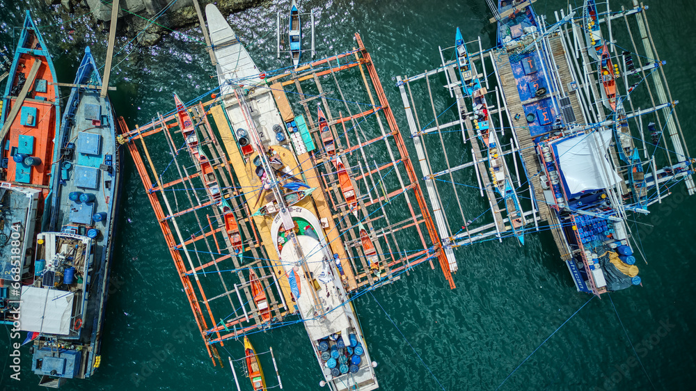 Fishing 'mother boats' carry smaller fishing boats an fish deeper ...