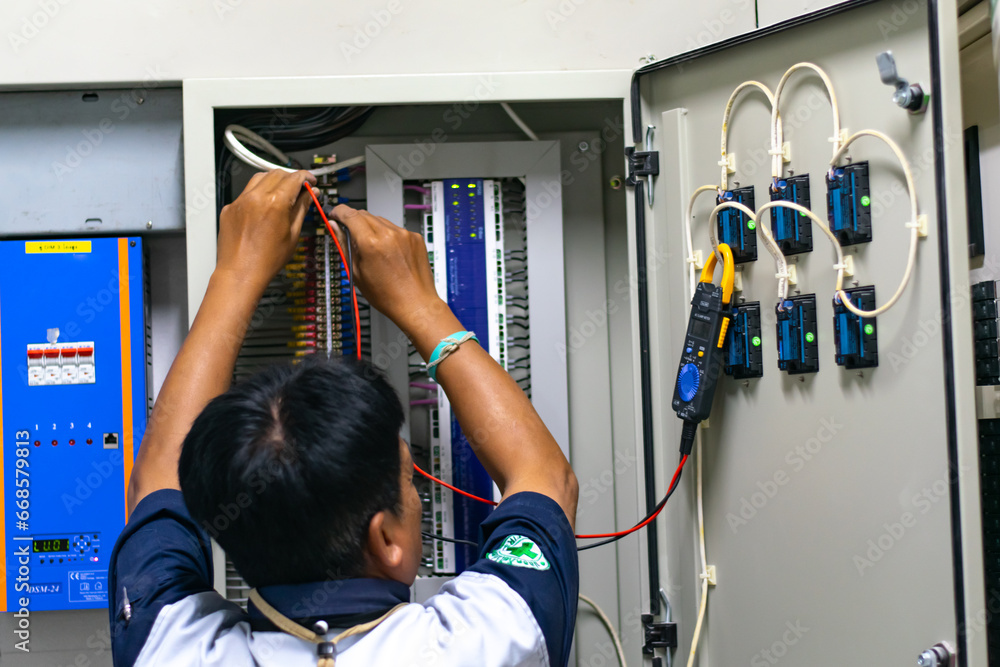 Electrician work tester measuring voltage and current of power electric ...