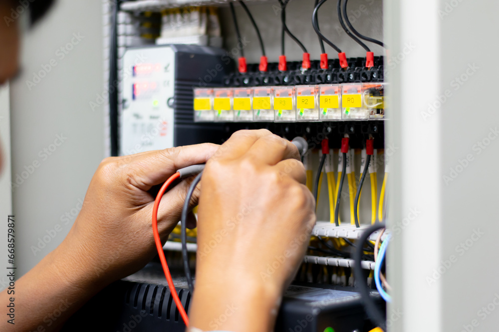 Electrician work tester measuring voltage and current of power electric ...