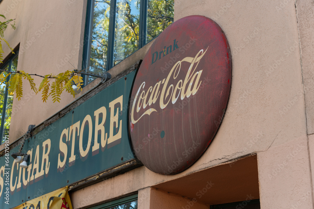 close-up sign of Mac's Cigar Store (with classic Coca-Cola roundel sign ...