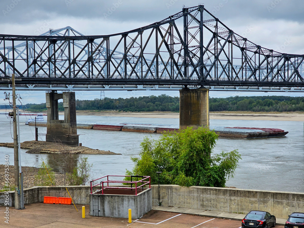 The Vicksburg Bridge over the flowing waters of the Mississippi river ...