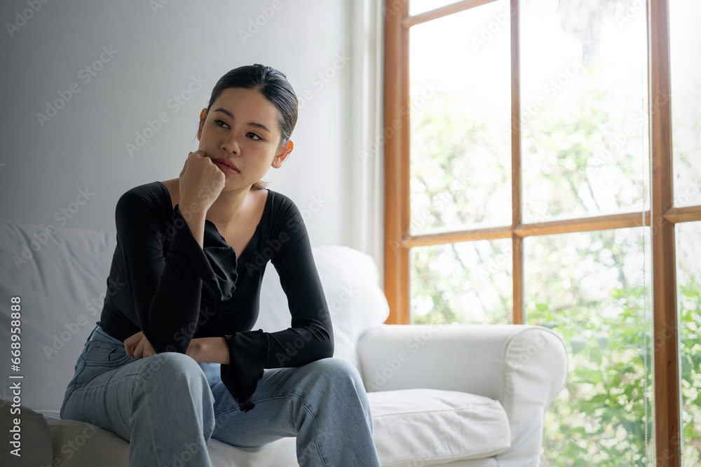 Foto de Depressed young Asian woman with mental health problem in mind ...