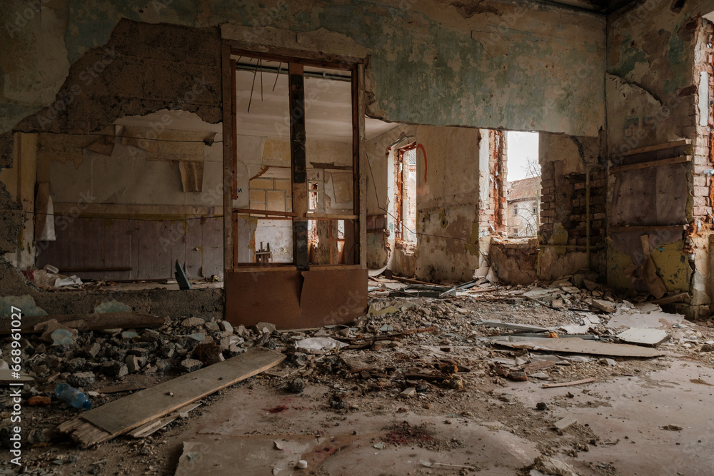 Interior of abandoned spacious room with glass door cabinet and broken ...