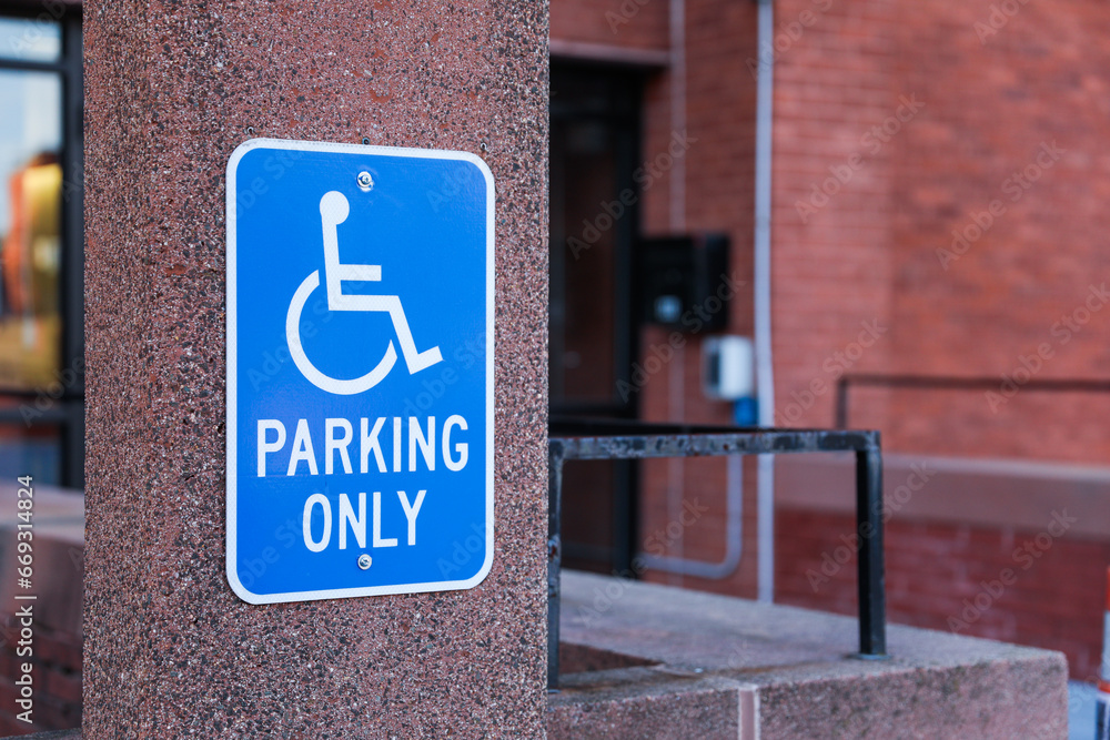 wheelchair accessibility sign against a vibrant urban backdrop ...
