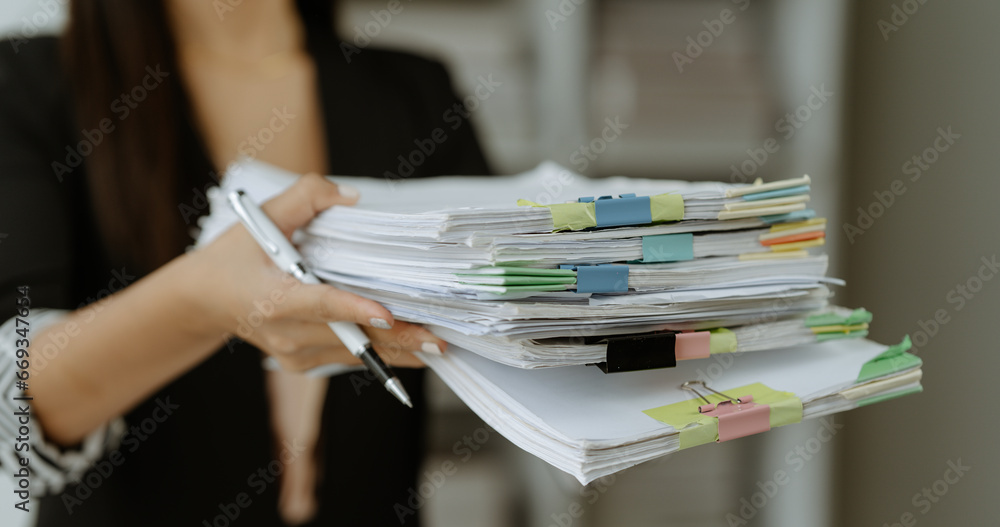 Businessman man working in stacks of papers searching for unfinished ...