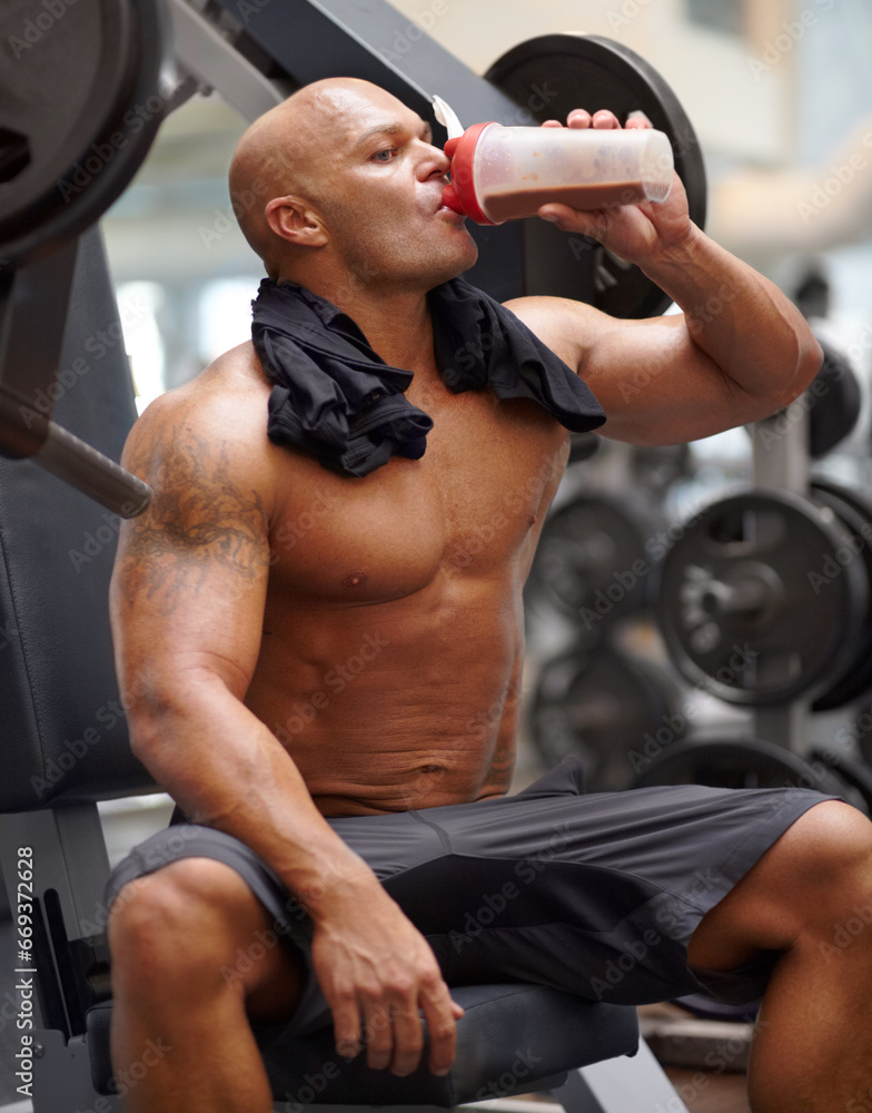 Man in gym, bodybuilder and drinking shake for fitness, training ...