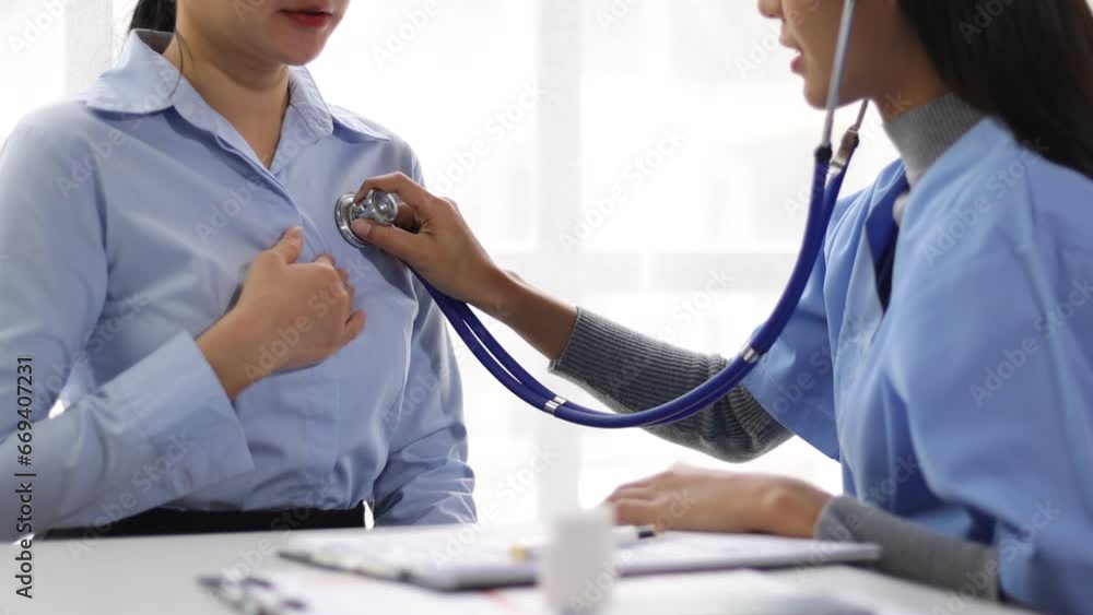 Female doctor uses stethoscope to examine body and diagnose disease of ...