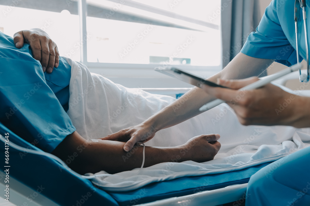 Injured patient showing doctor broken wrist and arm with bandage in ...