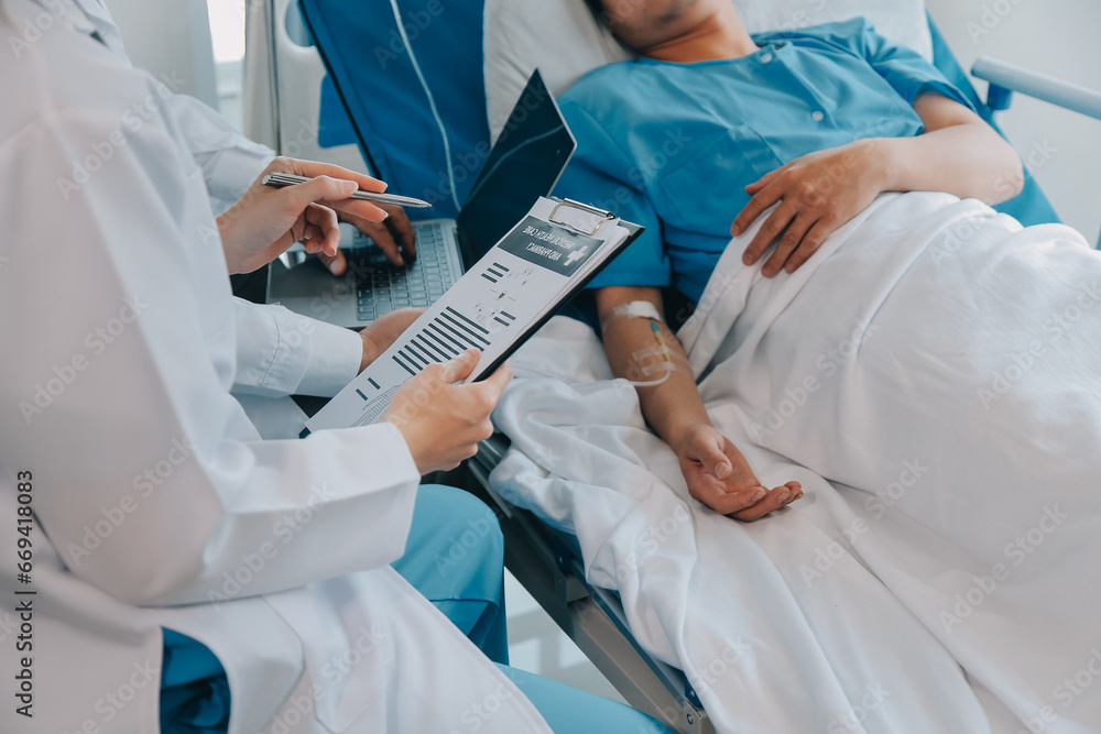 Injured patient showing doctor broken wrist and arm with bandage in ...