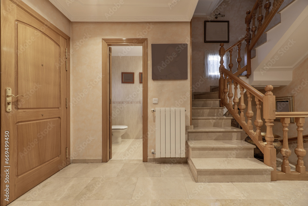 Corridor of a multi-storey detached house with light oak wood railings ...