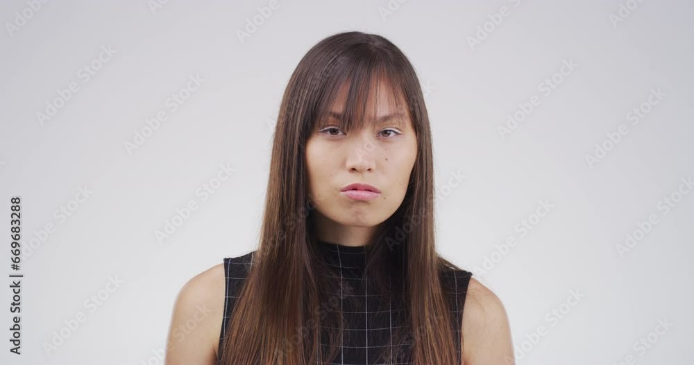 Sad, anxiety and face of woman in studio frustrated, angry or ...