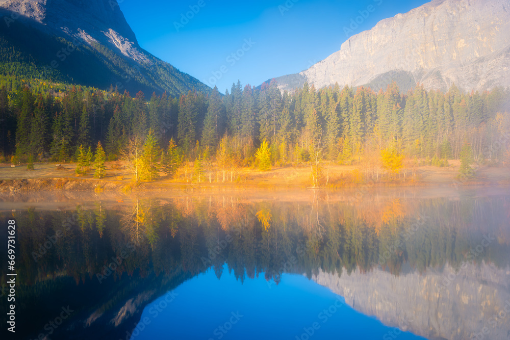 Fall. Landscape during sunrise. Autumn trees on the river bank ...