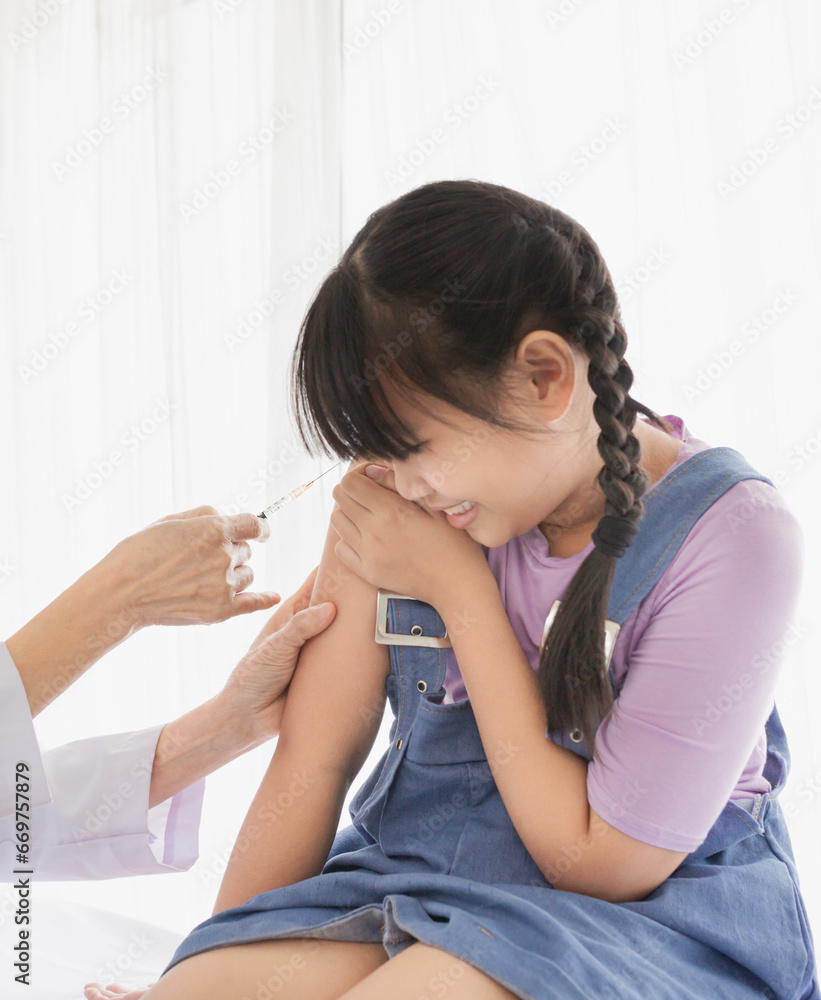 doctor use hand inject vaccine to asian girl, Deltoid muscle injection ...