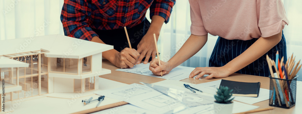 Smart architect engineer and interior designer working together and ...